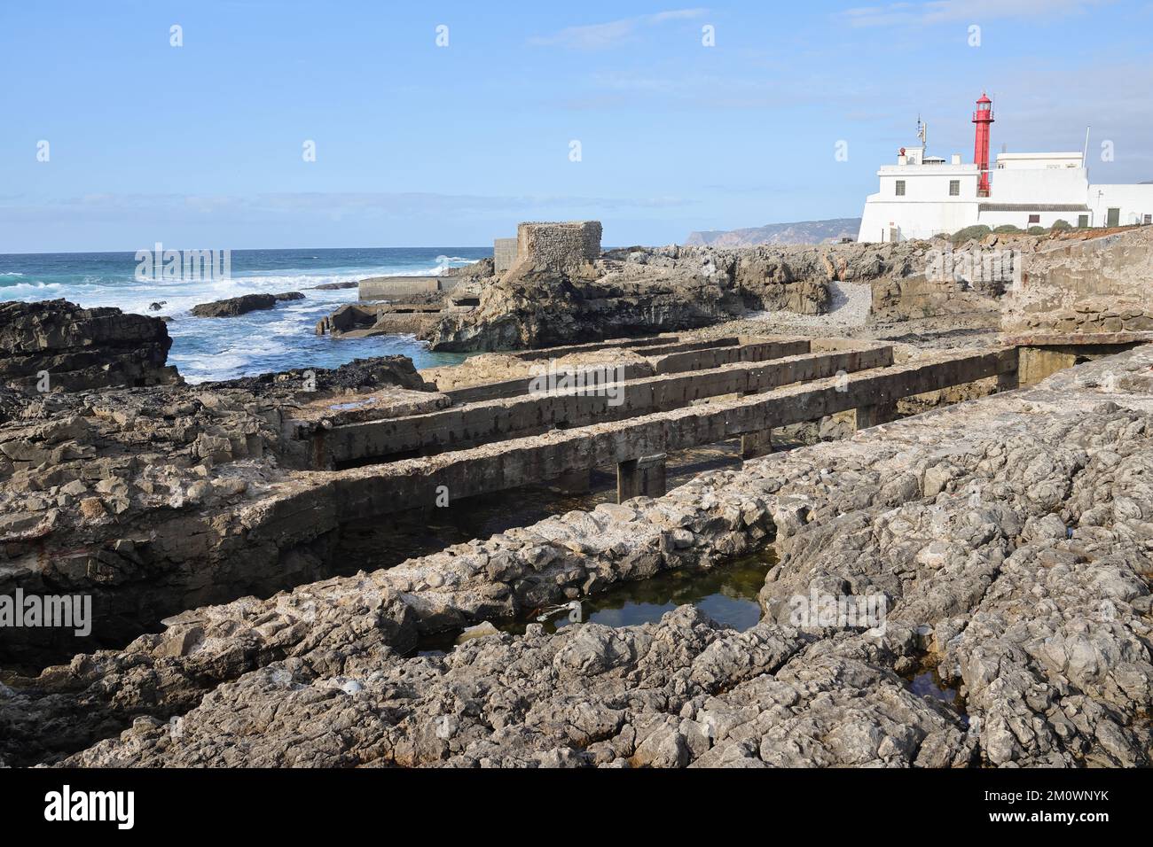The view of the rocky shore with Cabo Raso lighthouse in the background ...