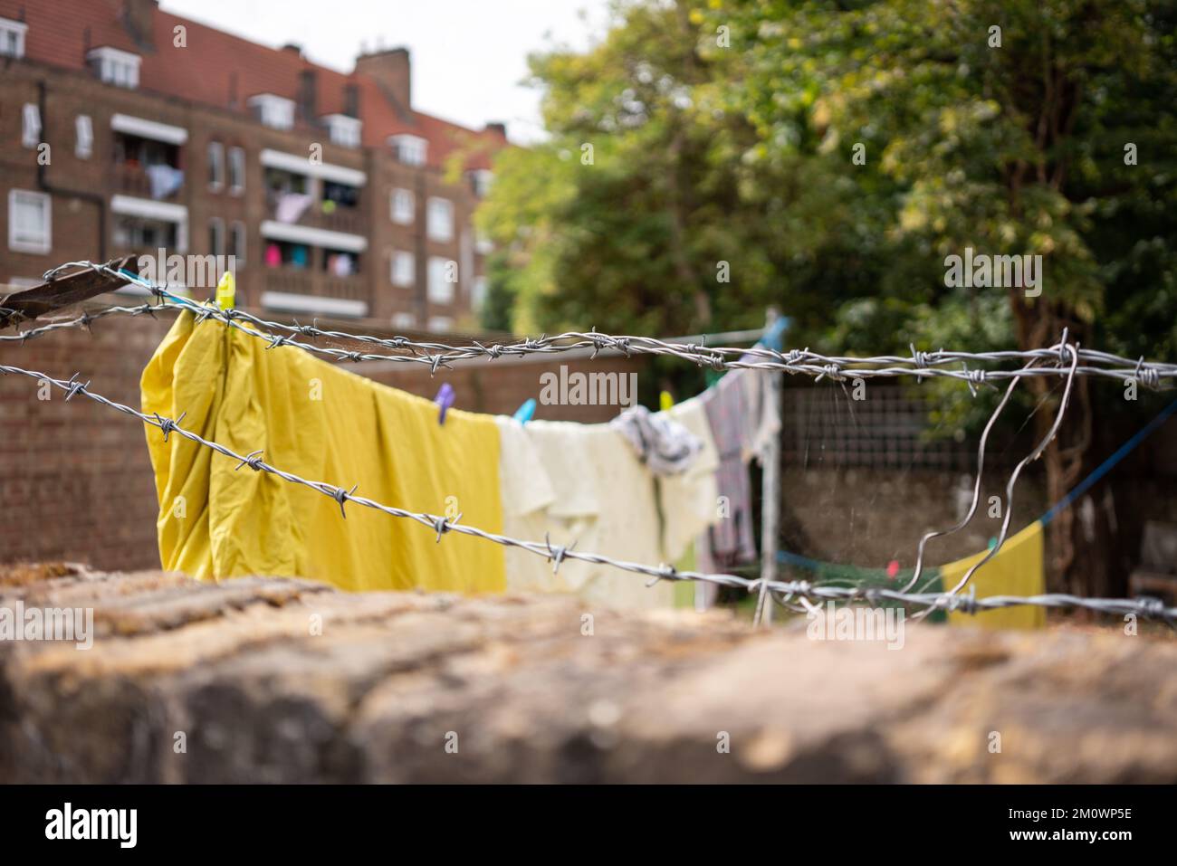 Council estate in south London with wall and barbed wire Stock Photo ...