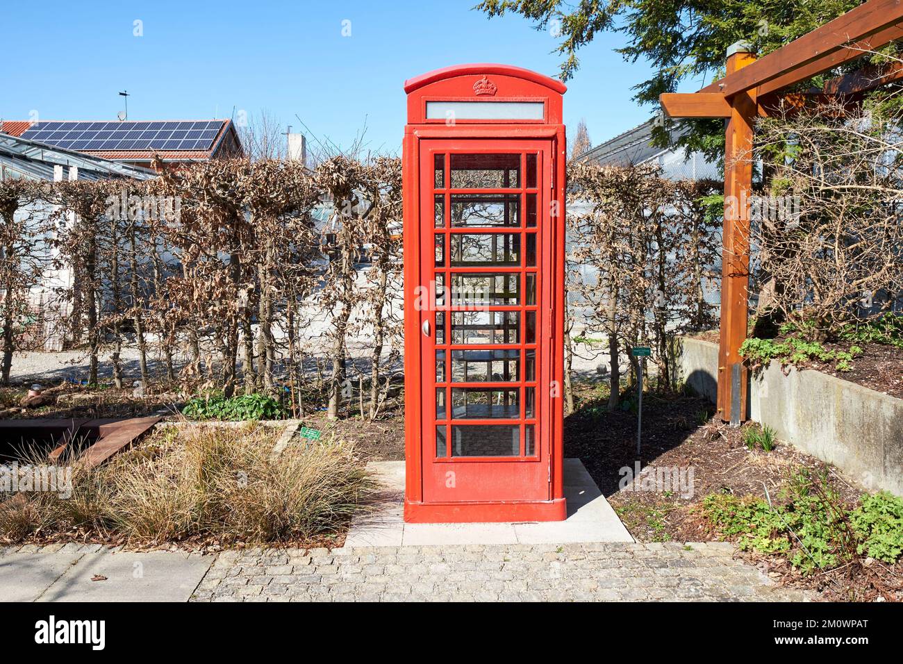 A red telephone cabin in Augsburg, Germany Stock Photo - Alamy