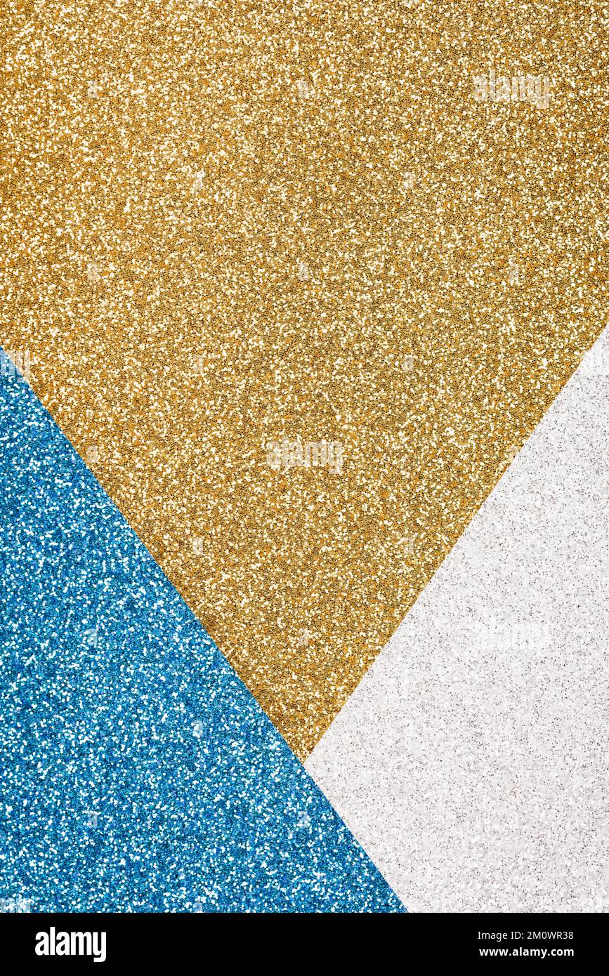 Festive glitter background in golden, blue and silver colours with copy ...