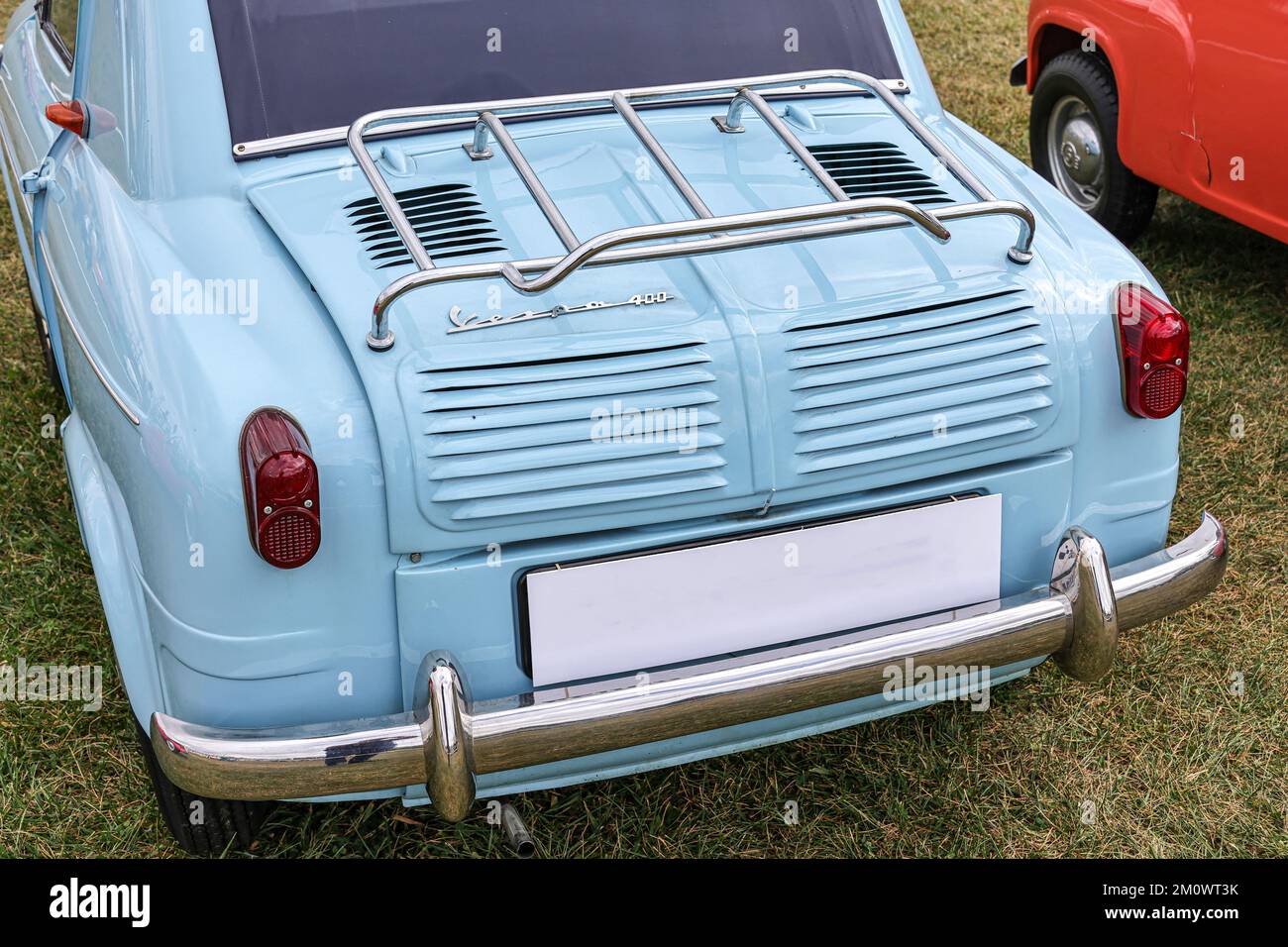 A rear view of a classic blue Piaggio Vespa 400 in a field Stock Photo ...