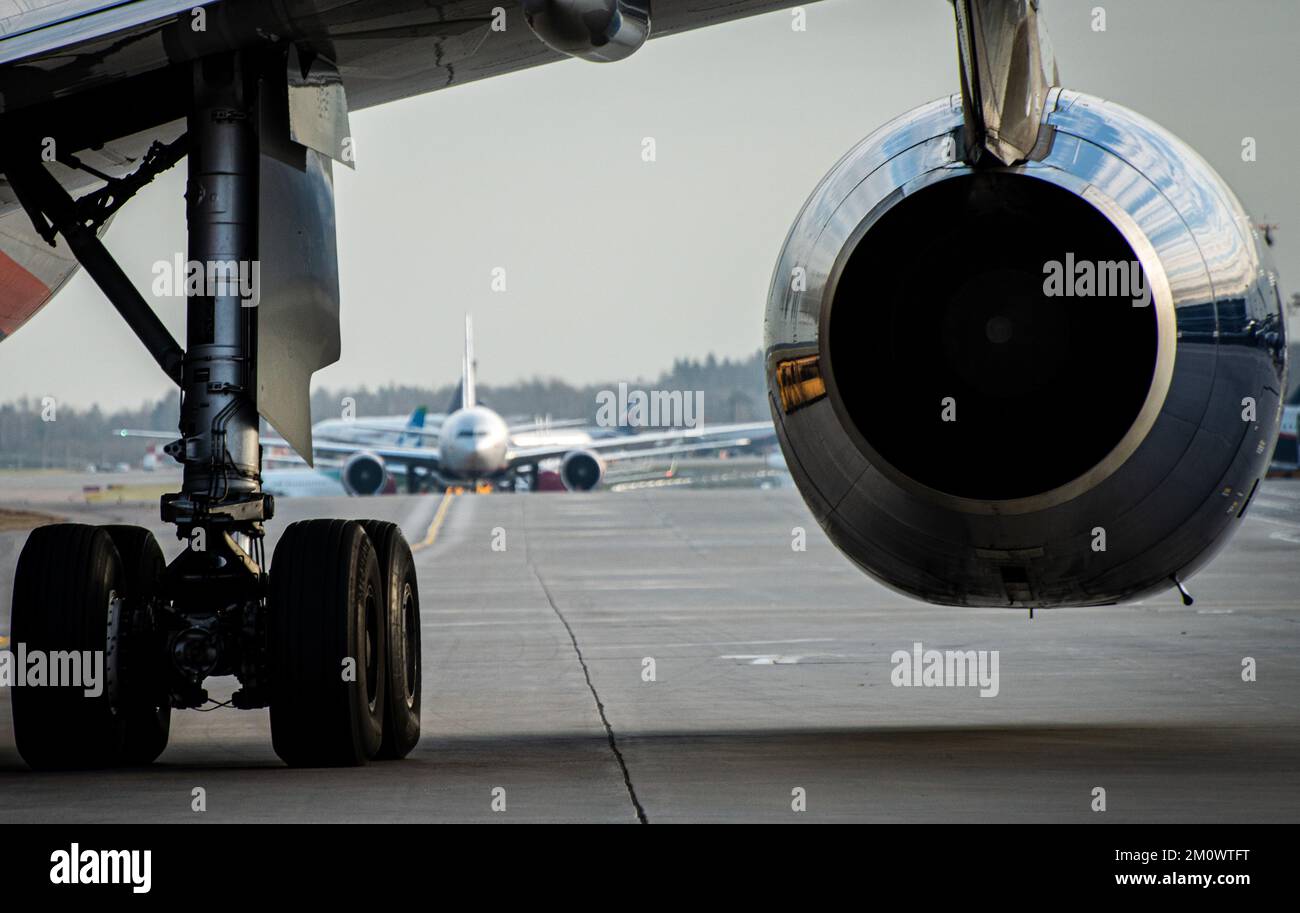 Jet engine under the wing of a modern passenger aircraft at an ...