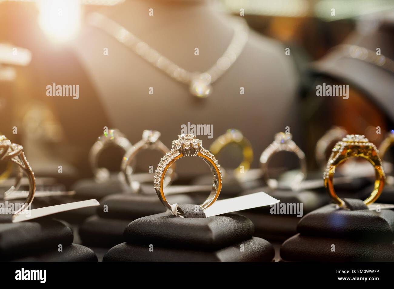 Jewelry diamond rings and necklaces show in luxury retail store window ...