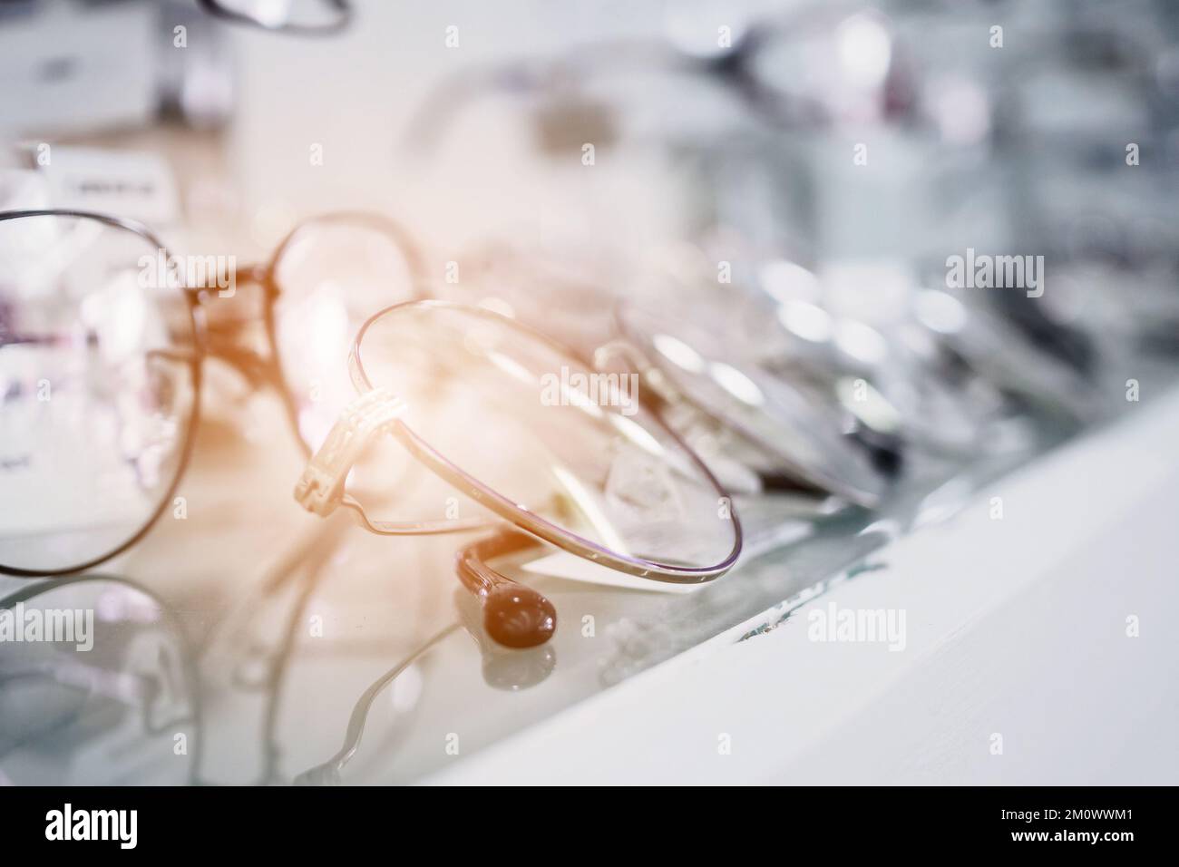 Eye glasses on window display shelves in optics store Stock Photo - Alamy