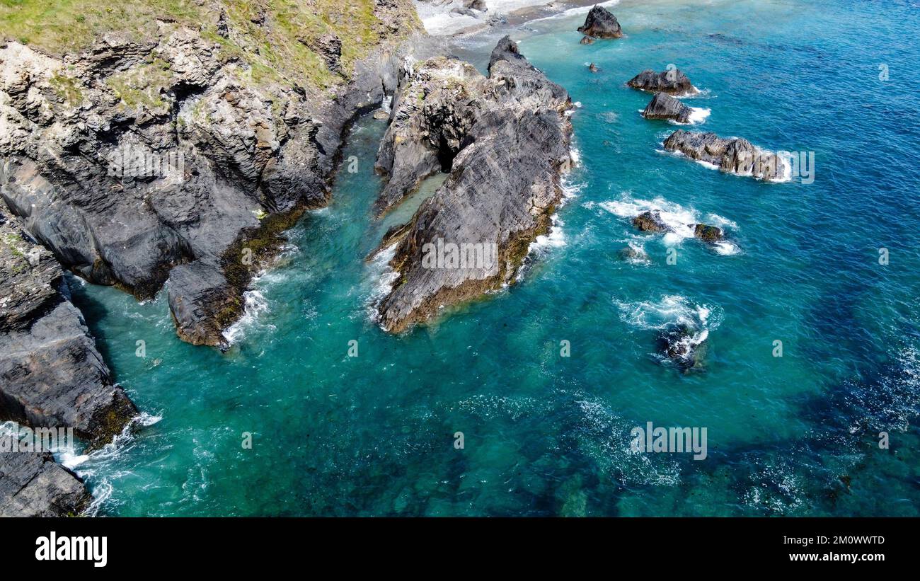 Steep cliffs on the coast of Ireland. Turquoise waters of the Atlantic Ocean. Natural beauties ...