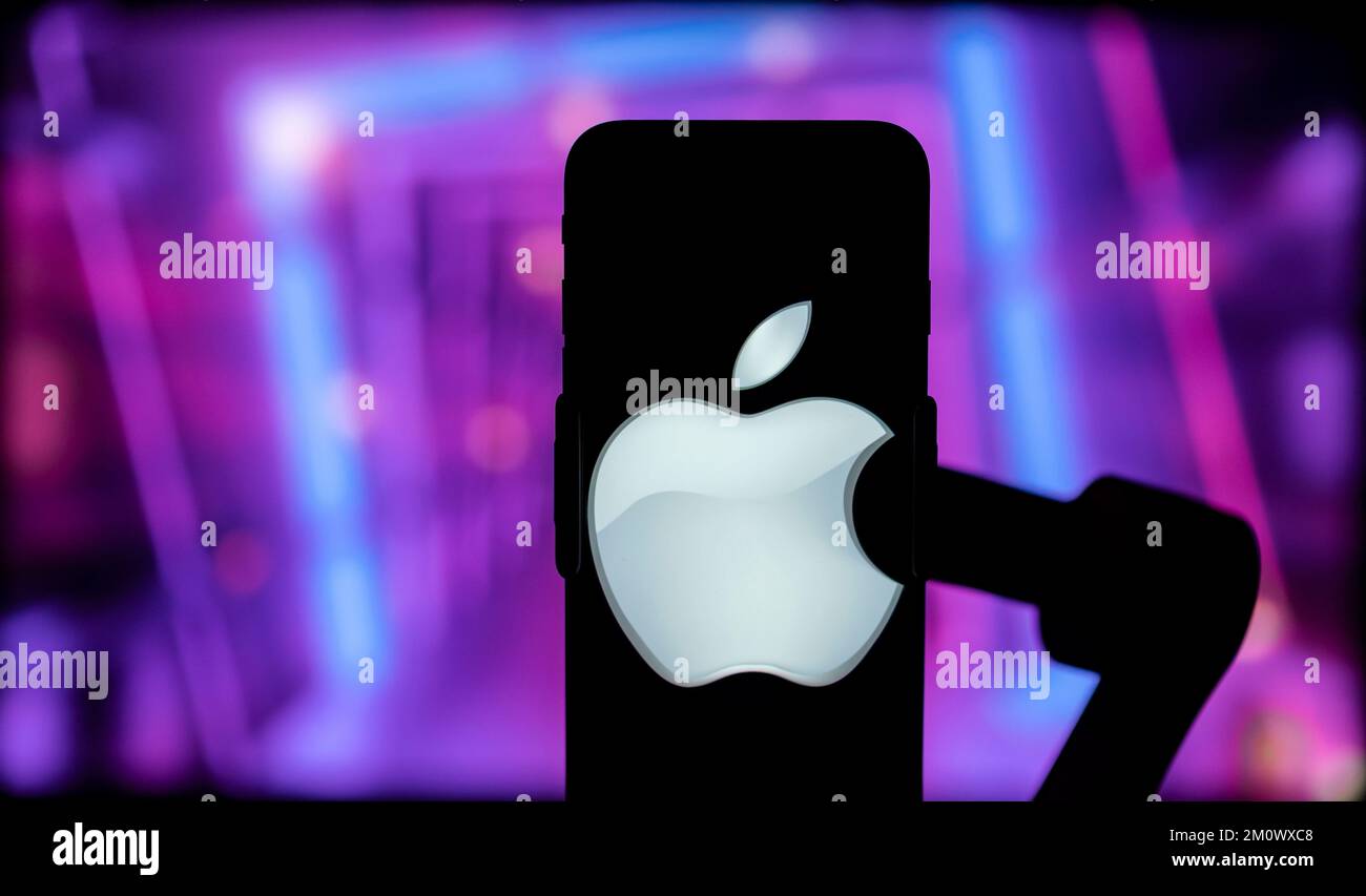 In this photo illustration, a logo of apple mobile company is seen on a ...