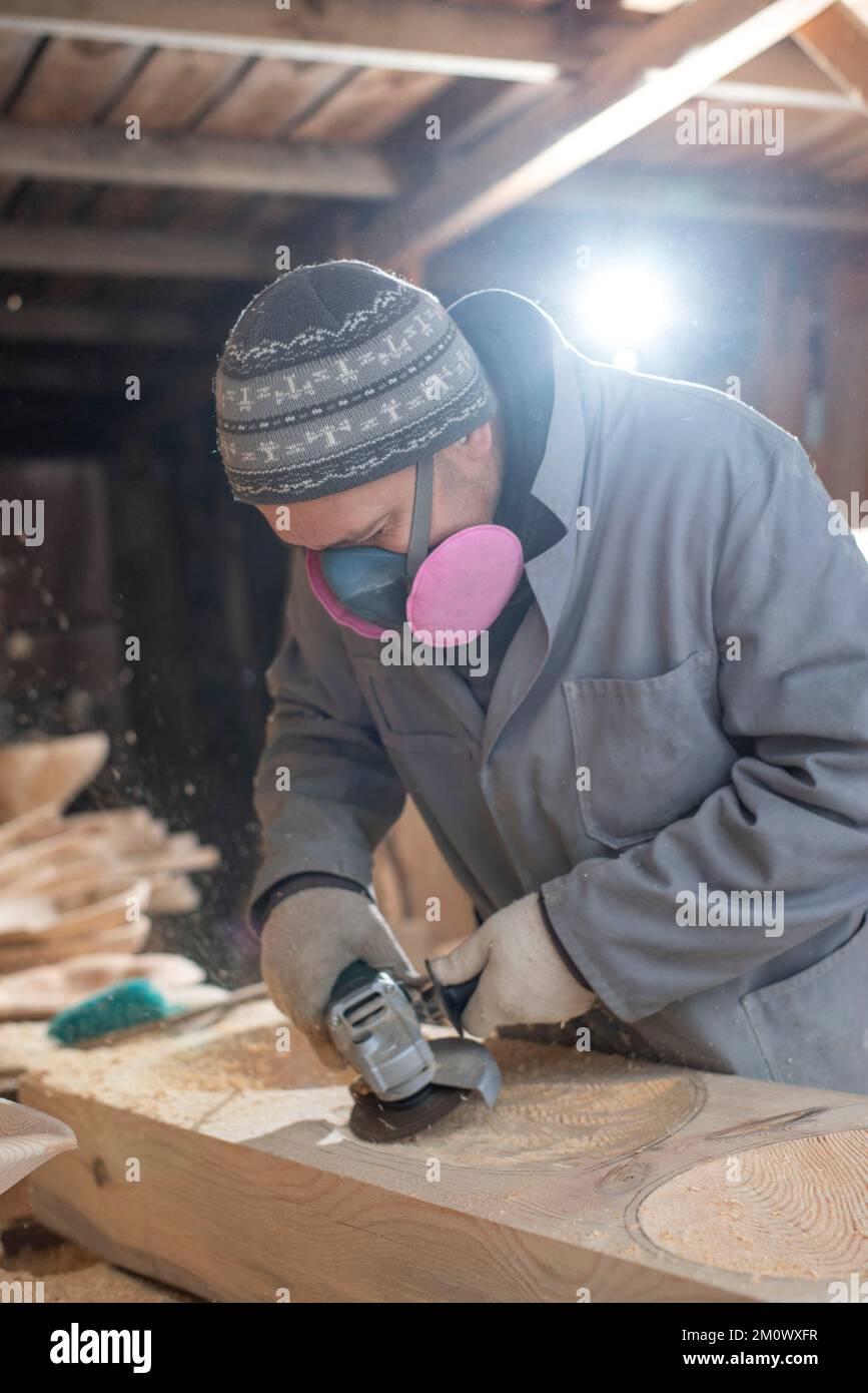craftsman carves the plates out of wood by hand. The Art of the ...