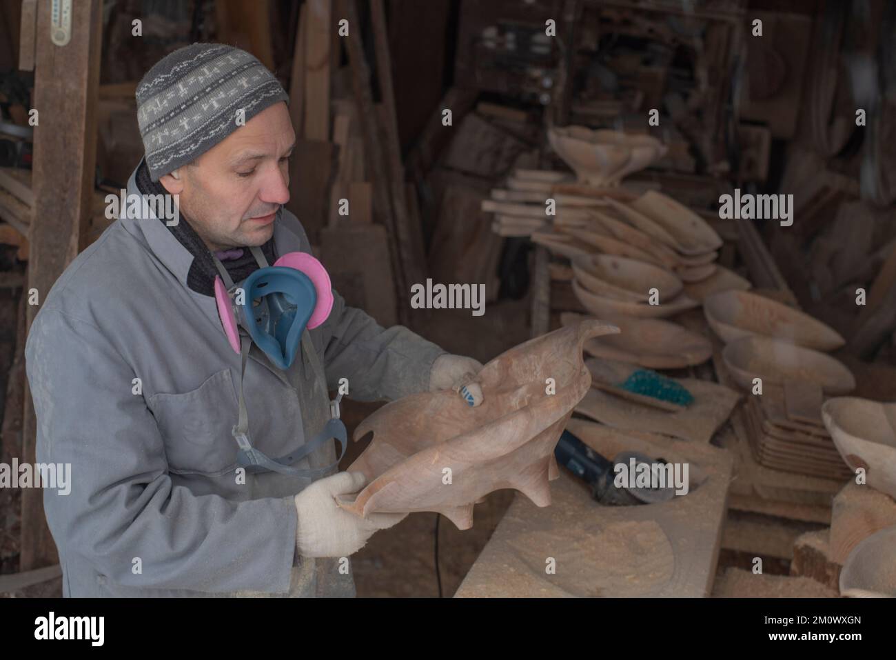 craftsman carves the plates out of wood by hand. The Art of the ...