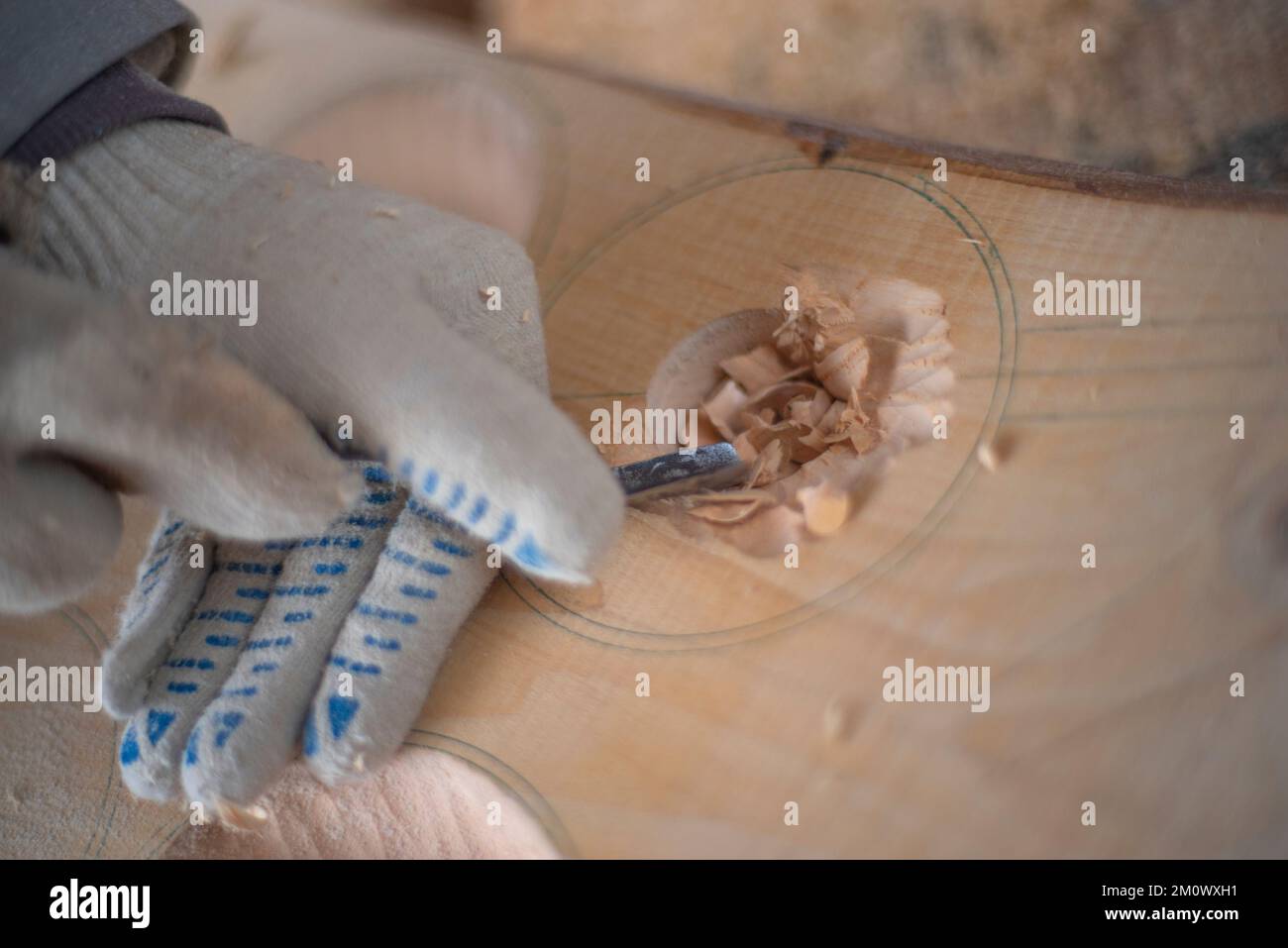 craftsman carves the plates out of wood by hand. The Art of the ...