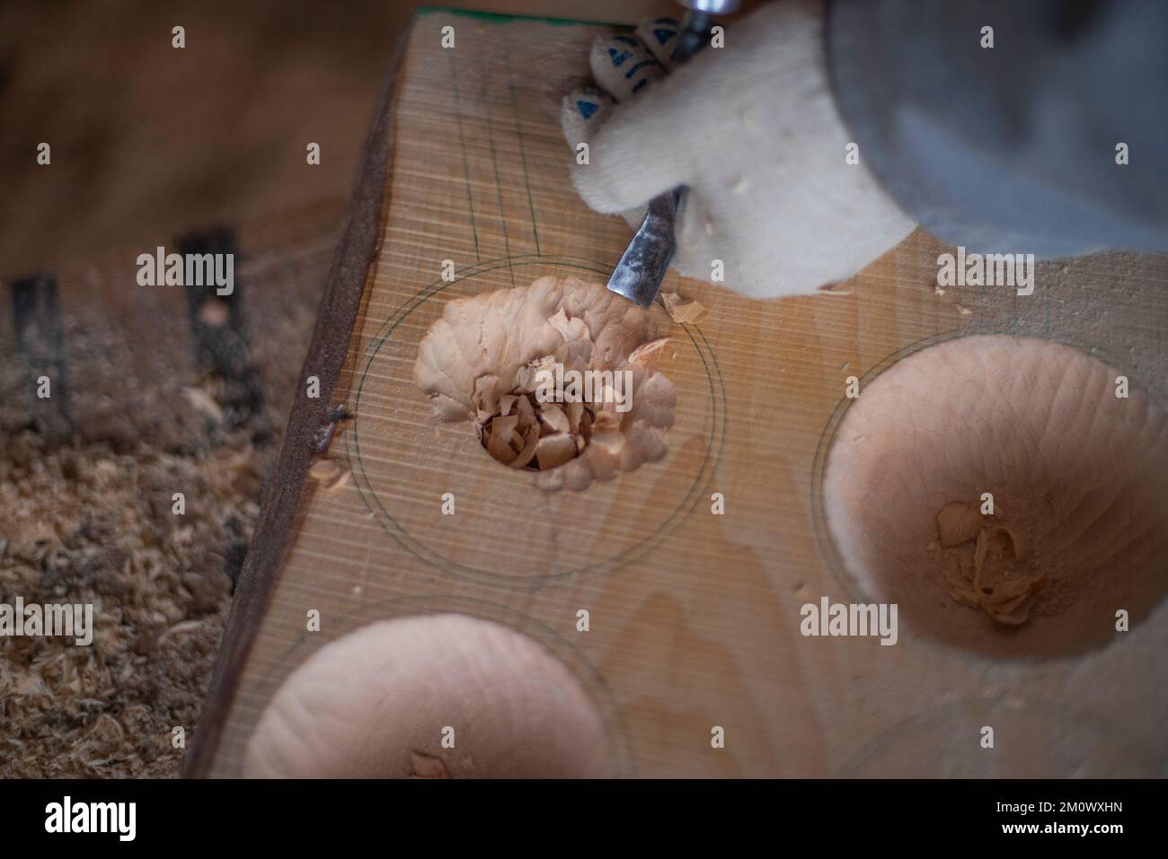 craftsman carves the plates out of wood by hand. The Art of the ...