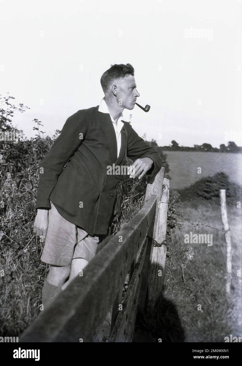 1950s, historical, a man outside enjoying the British countryside ...
