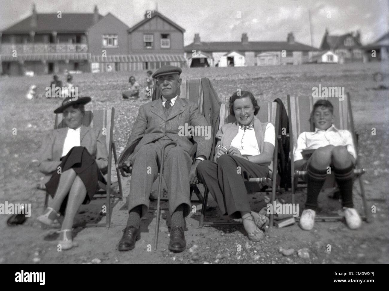 circa 1930s, historical, oh to be beside the sea....outside on a beach ...