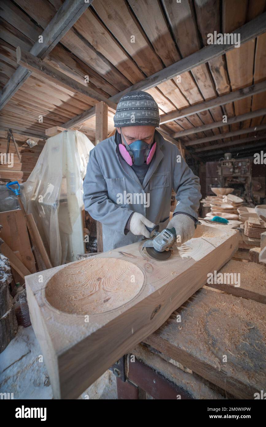 craftsman carves the plates out of wood by hand. The Art of the ...
