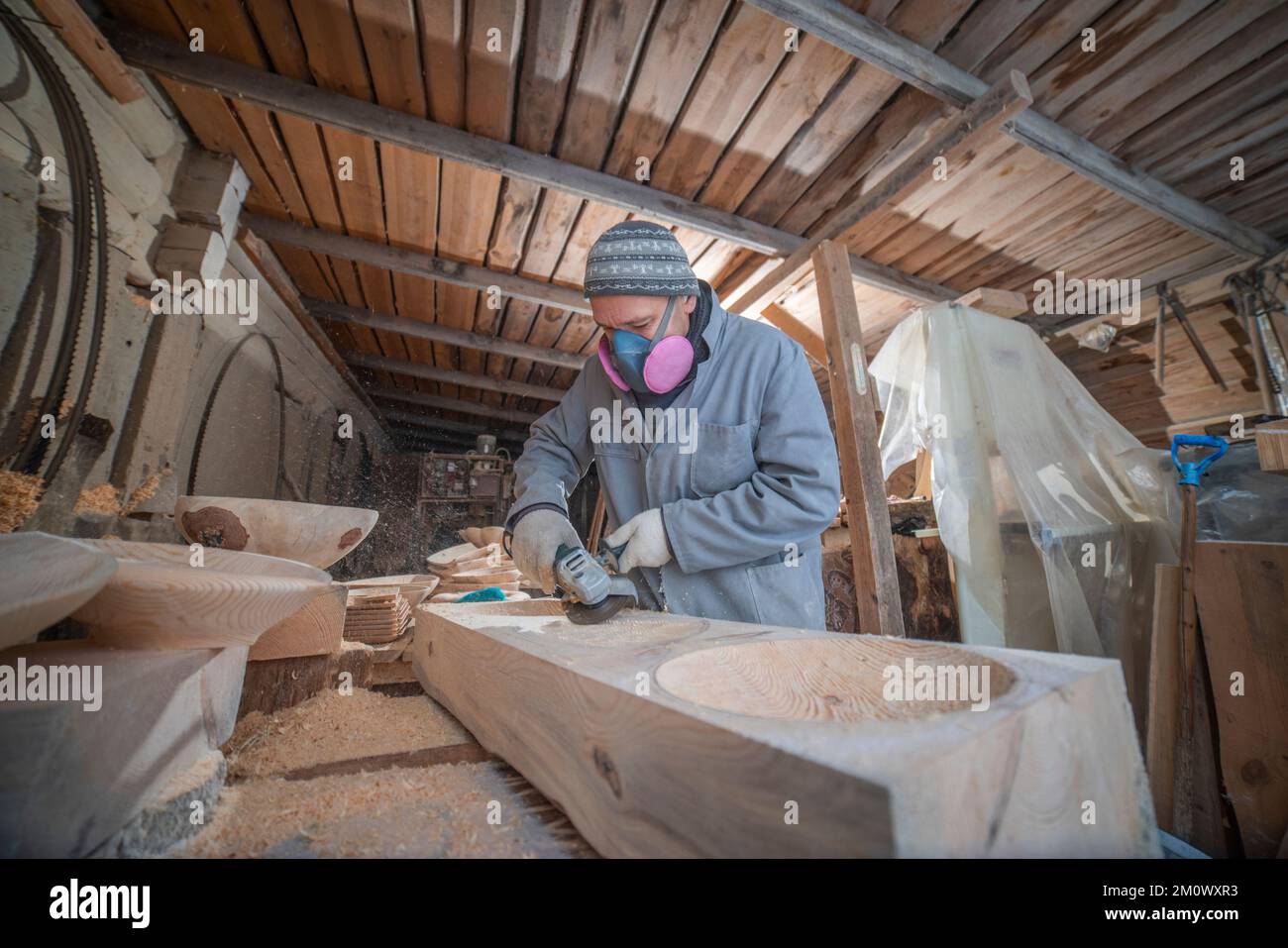 craftsman carves the plates out of wood by hand. The Art of the ...