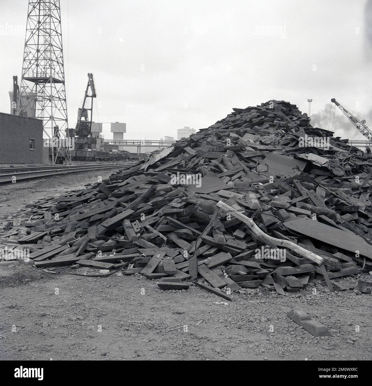 1950s, historical, steelworks, a stack of industrial waste sat in a ...