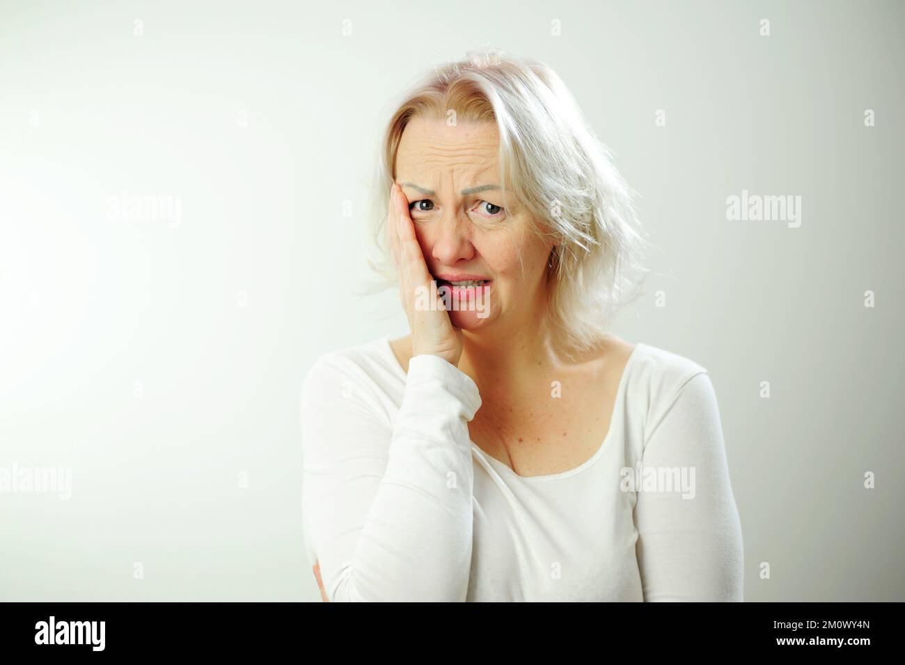 Portrait of displeased upset female frowns face as going to cry, being ... Portrait of displeased upset female frowns face as going to cry, being ...