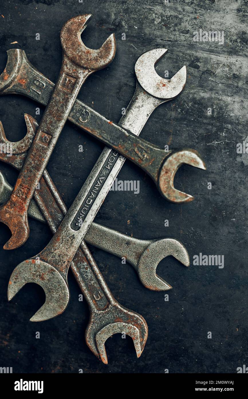 Spanners on steel surface. Old rusty wrenches for maintenance. Mechanic ...