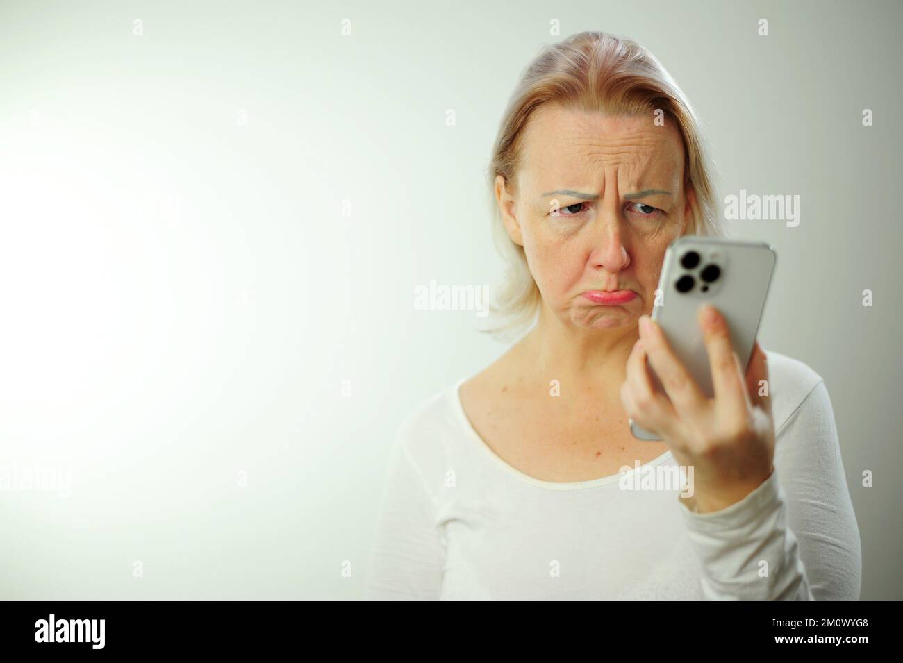 upset cute woman blond hair childishly offended Sad adult woman holding ...