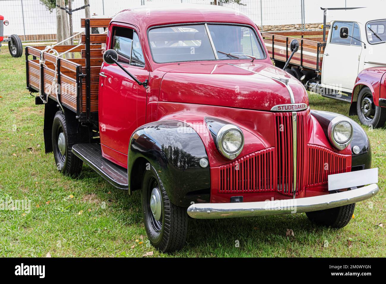 A side view of a classic Studebaker pickup truck with a wooden trunk in ...