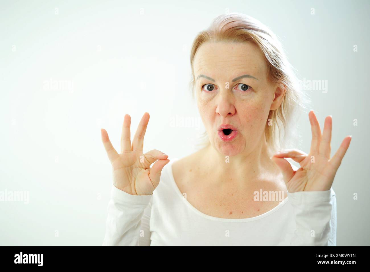 Closeup image of a woman making and showing ok hand sign Pin-up retro ...