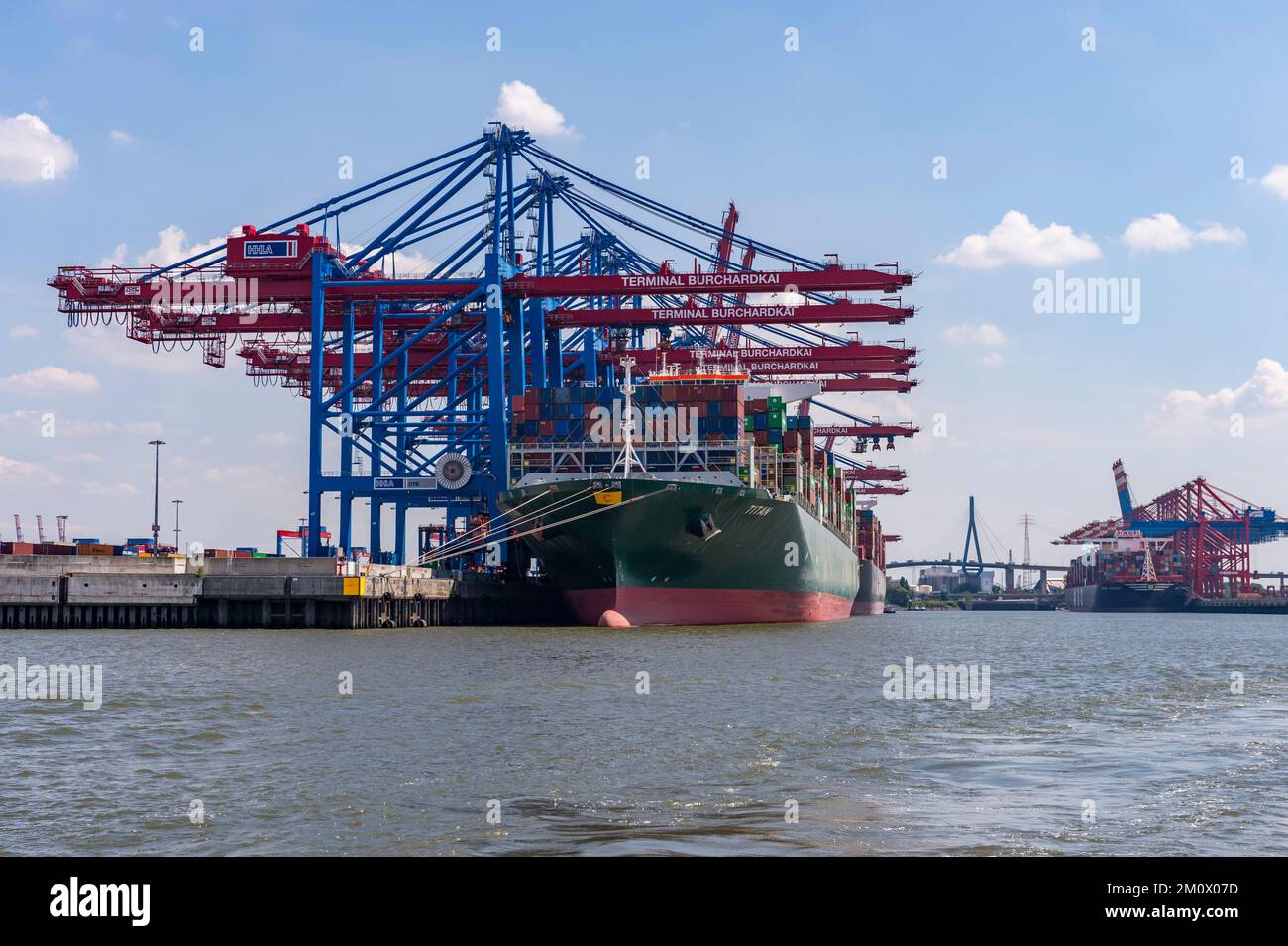 A container ship is being loaded in Hamburg container port, Germany ...