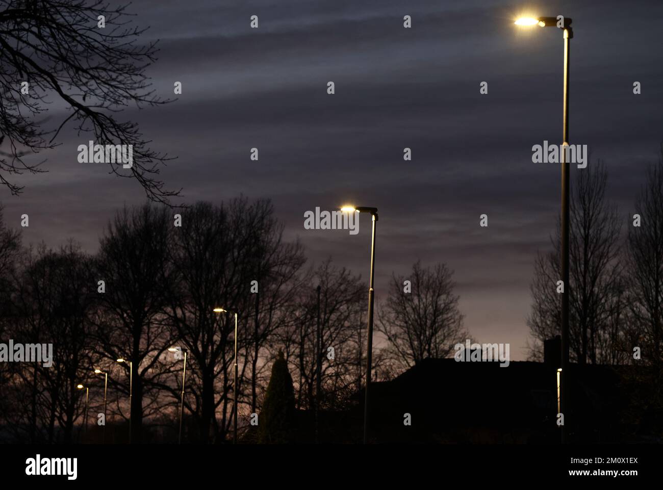 Street lights on a street in a city Stock Photo - Alamy