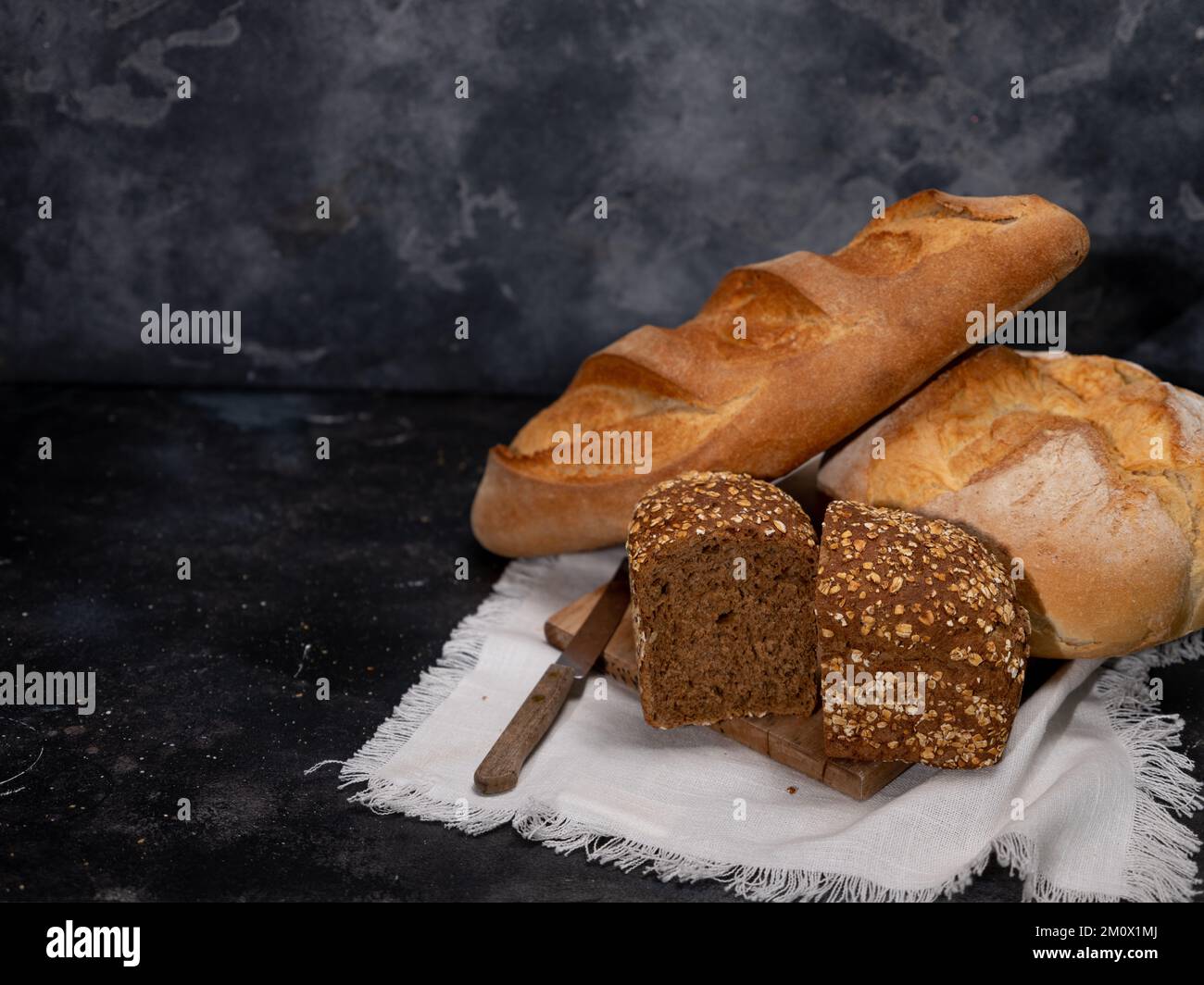 bread with seeds on a beach concrete background Stock Photo - Alamy