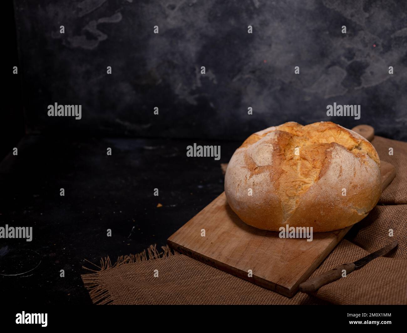 bread with seeds on a beach concrete background Stock Photo - Alamy
