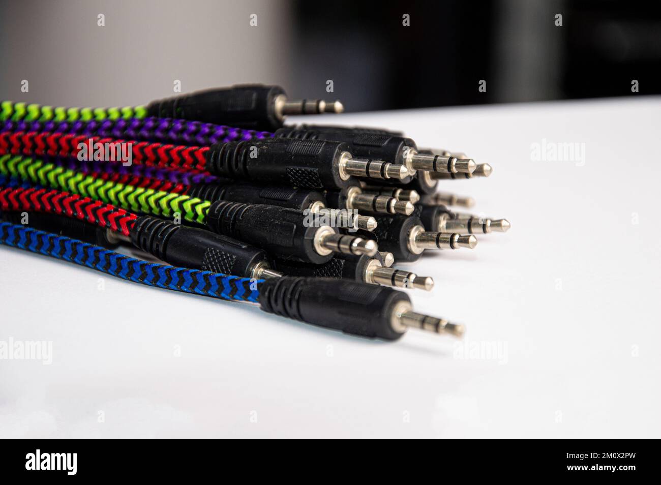 Many audio connector jacks laying on white background Stock Photo - Alamy