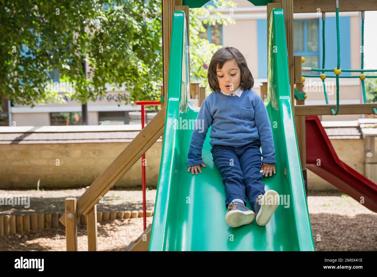 Child playing on outdoor playground Stock Photo - Alamy