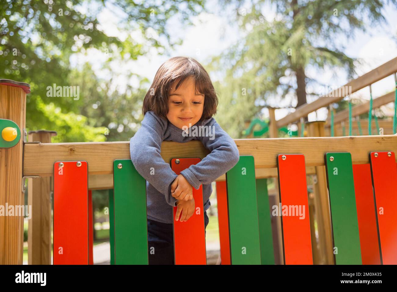 Child playing on outdoor playground Stock Photo - Alamy