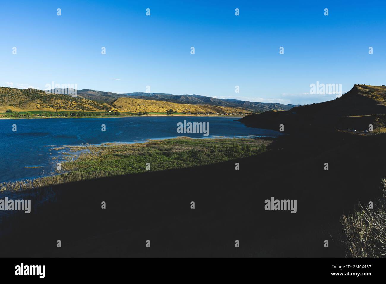 The Echo lake with green grass under clear blue sky Stock Photo - Alamy