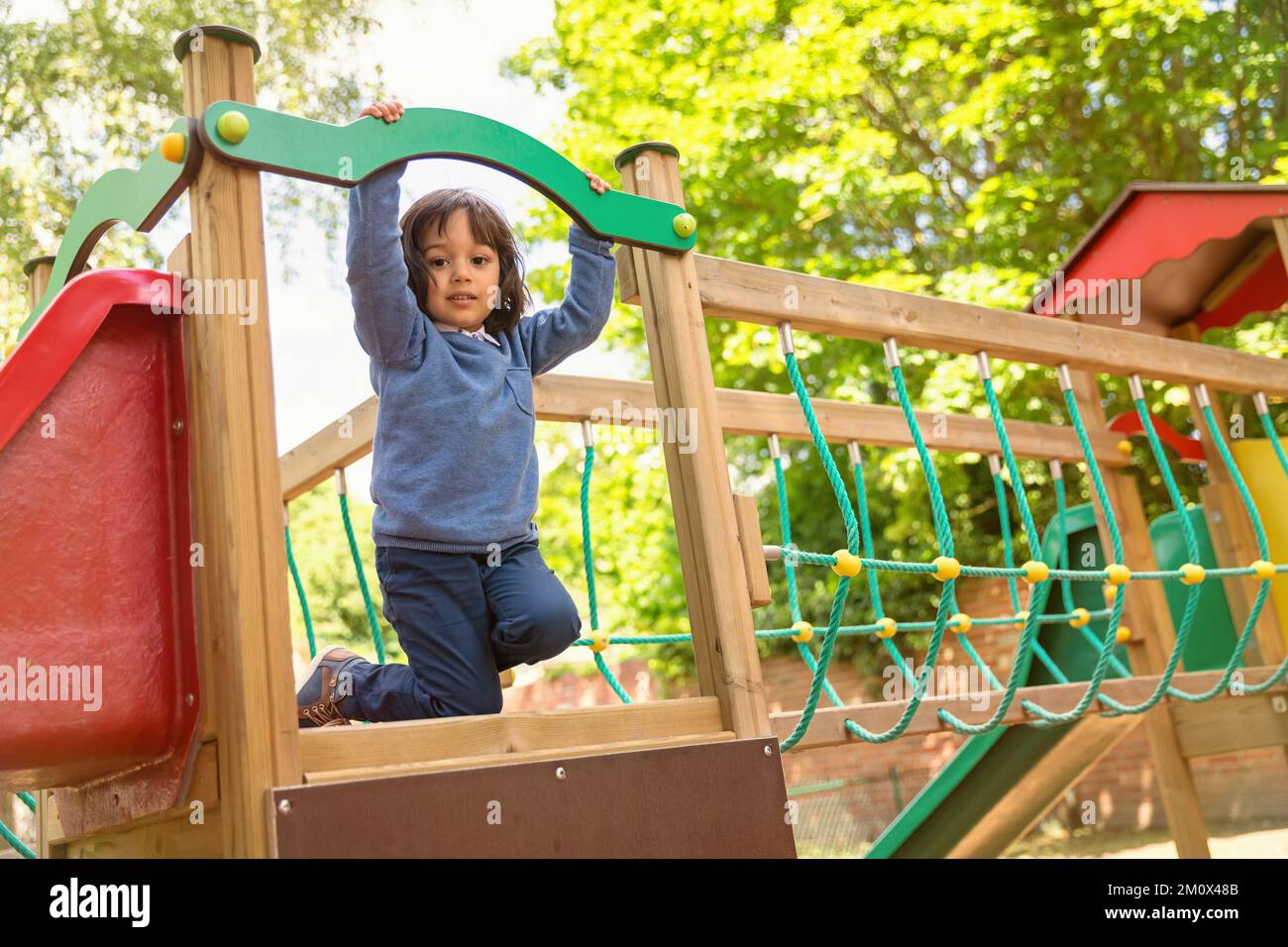 Child playing on outdoor playground Stock Photo - Alamy