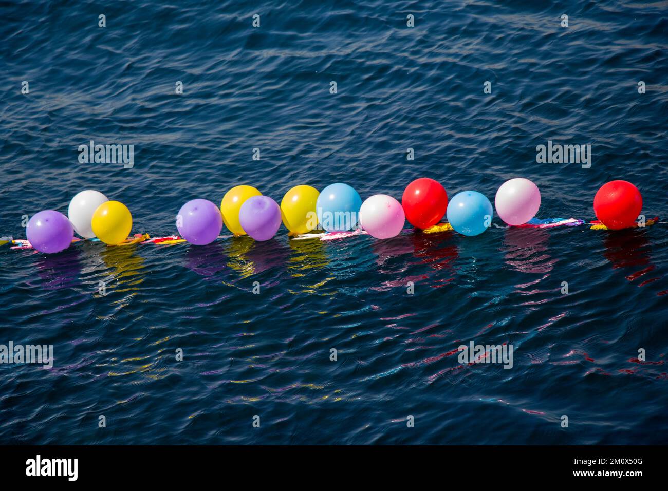 Balloons in shooting range as targets on water Stock Photo - Alamy