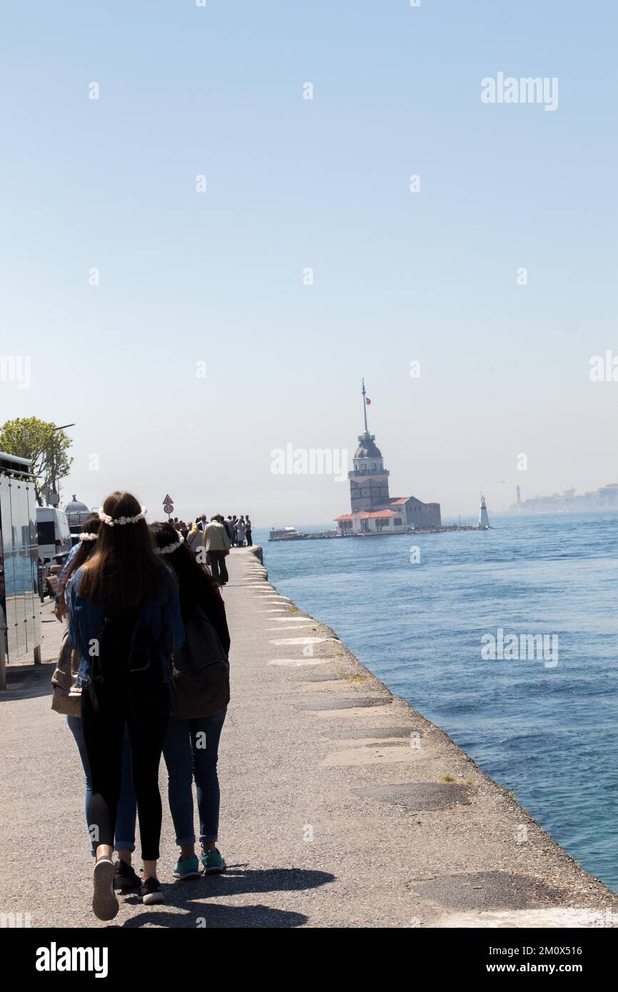 People towards Maidens Tower located in the middle of Bosporus Stock ...