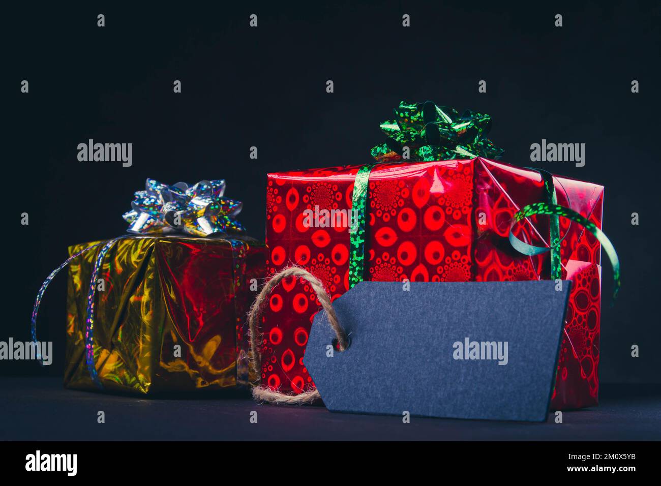 New Year's gift on a black background. Buying gifts The price tag on ...