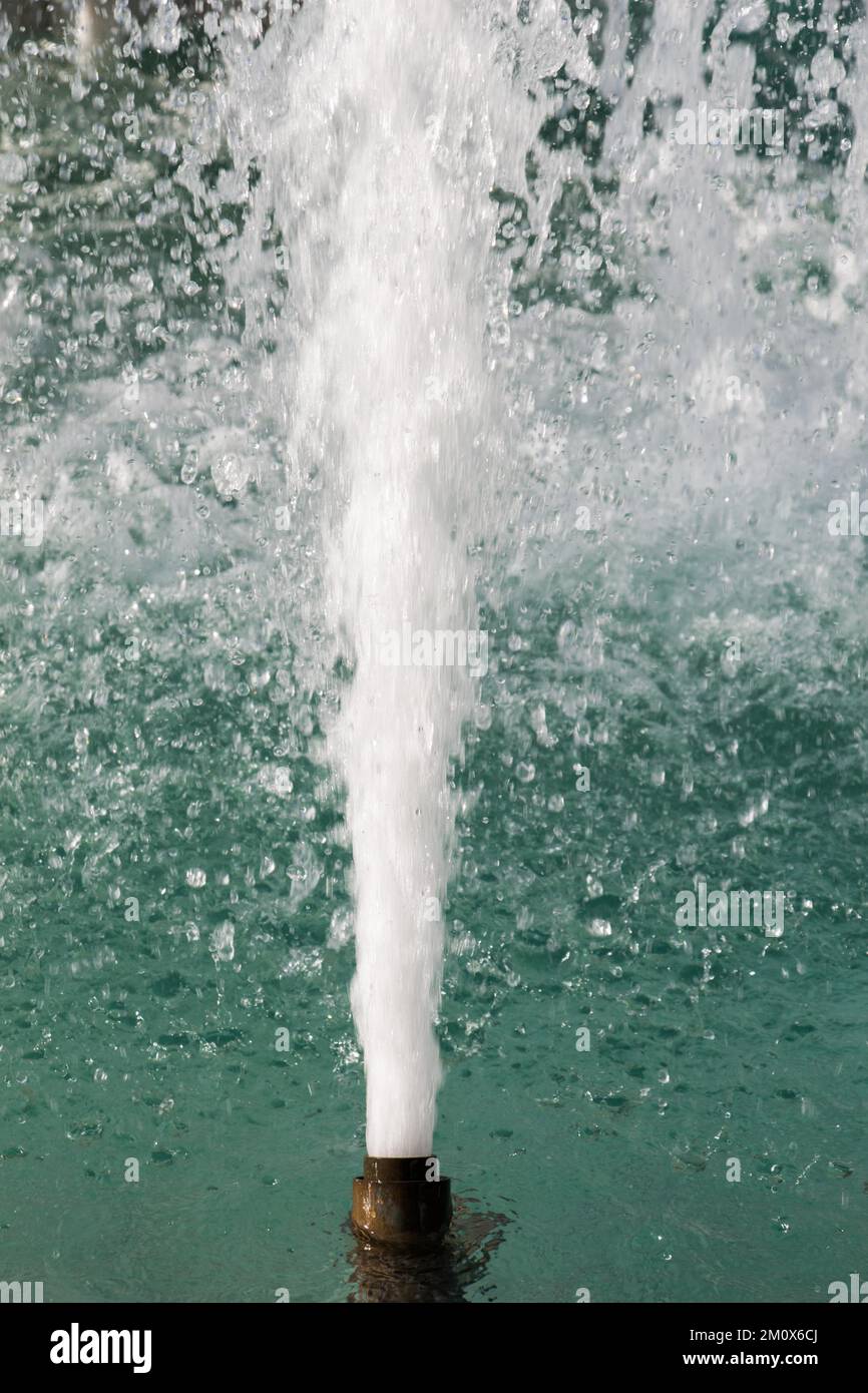 The fountains gushing sparkling water in a pool in a park Stock Photo ...
