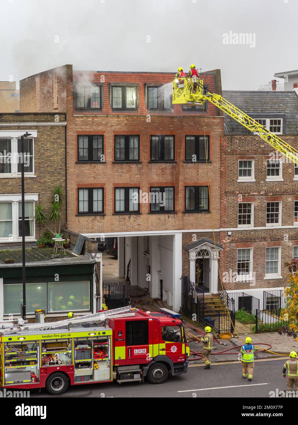 Fire Brigade attend to a fire in a residential building Stock Photo - Alamy