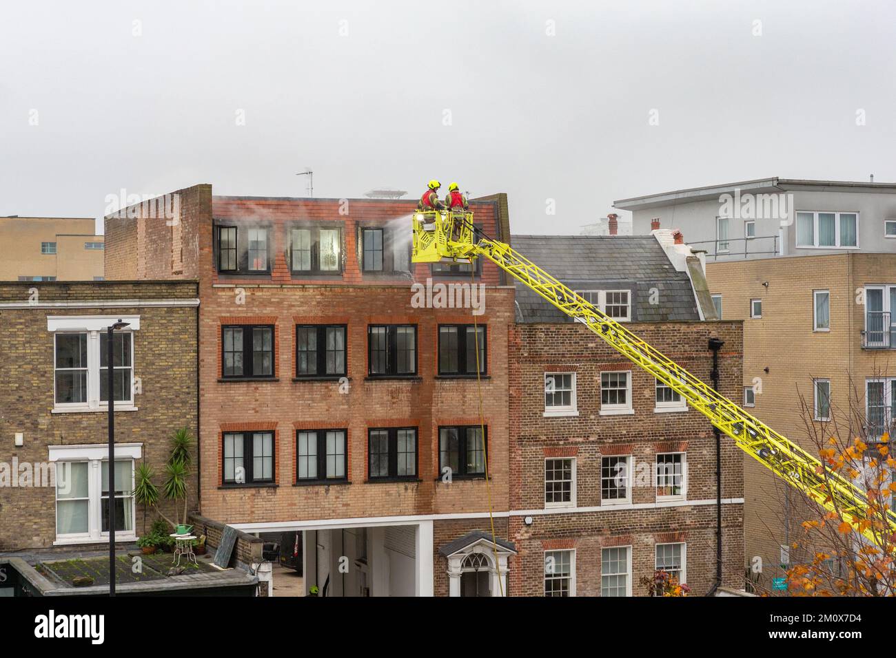 Fire Brigade attend to a fire in a residential building Stock Photo - Alamy