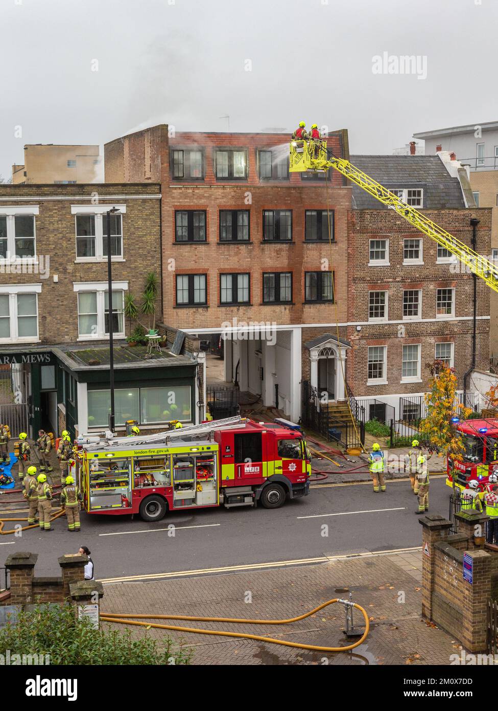 Fire Brigade attend to a fire in a residential building Stock Photo - Alamy