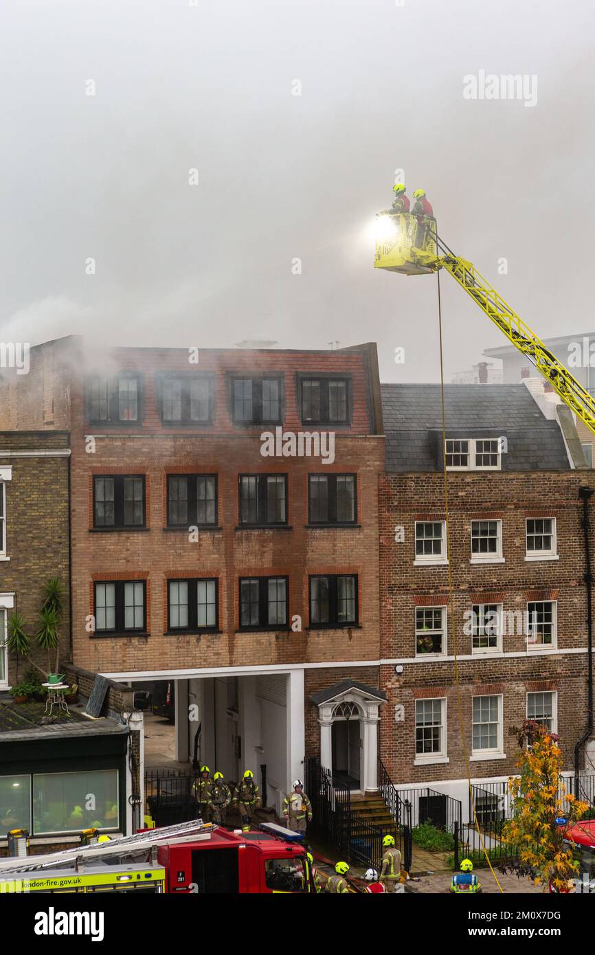 Fire Brigade attend to a fire in a residential building Stock Photo - Alamy