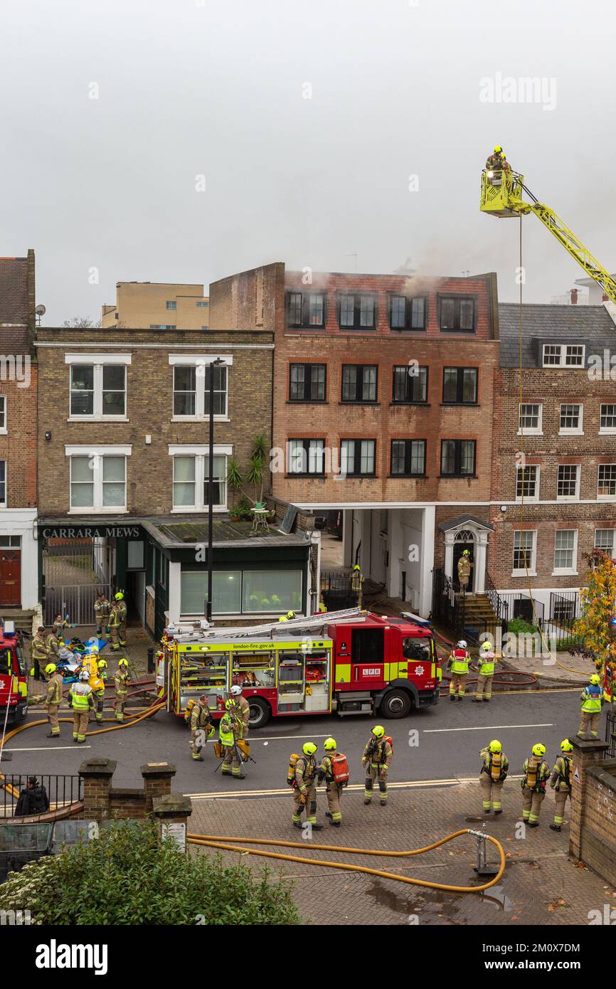 Fire Brigade attend to a fire in a residential building Stock Photo - Alamy