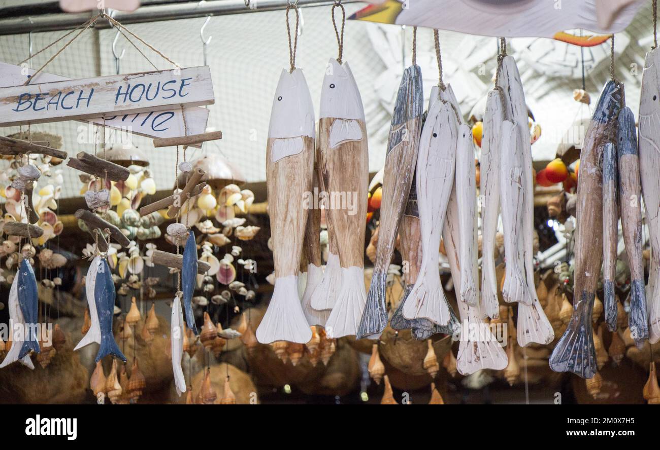Beautiful wooden fish for decoration on a a string Stock Photo - Alamy