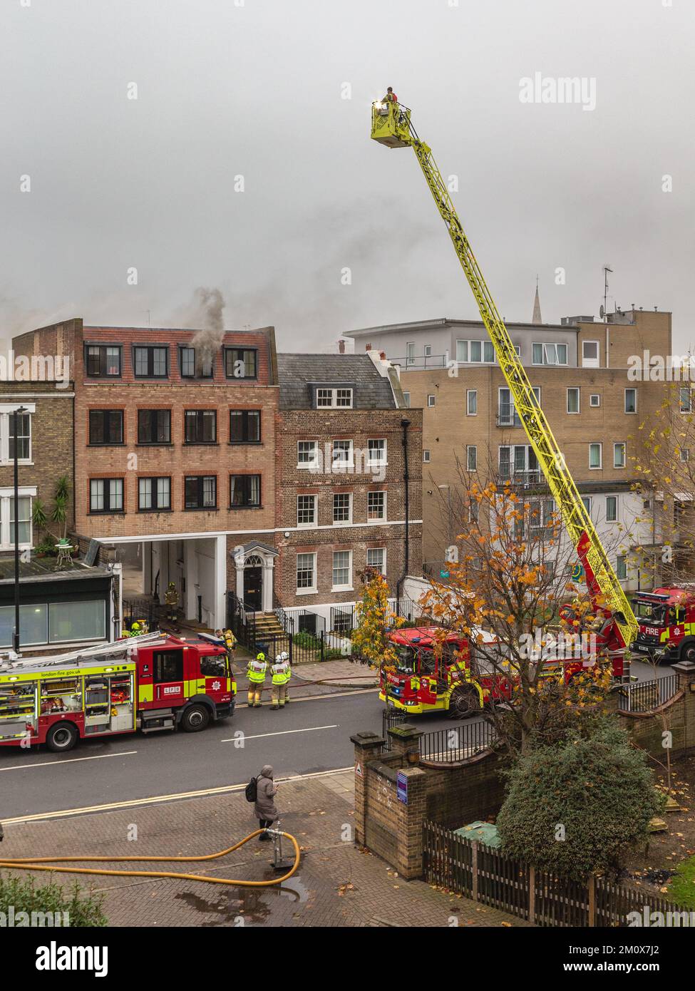 Fire Brigade attend to a fire in a residential building Stock Photo - Alamy