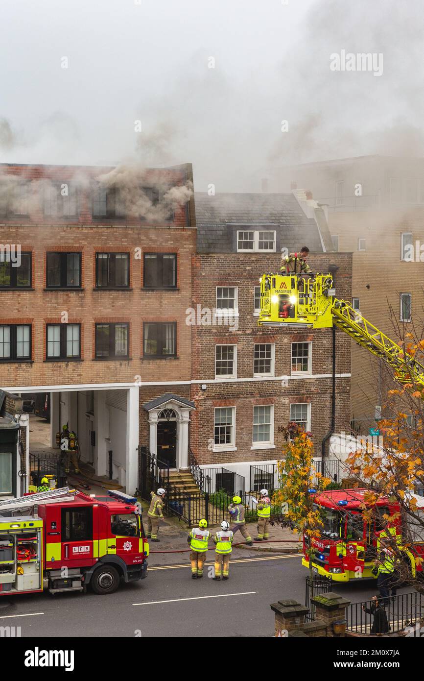 Fire Brigade attend to a fire in a residential building Stock Photo - Alamy