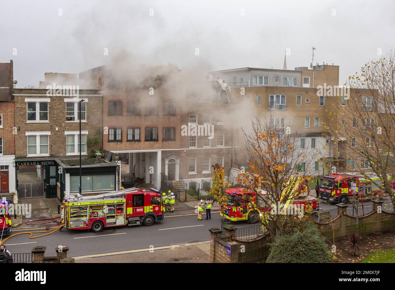 Fire Brigade attend to a fire in a residential building Stock Photo - Alamy