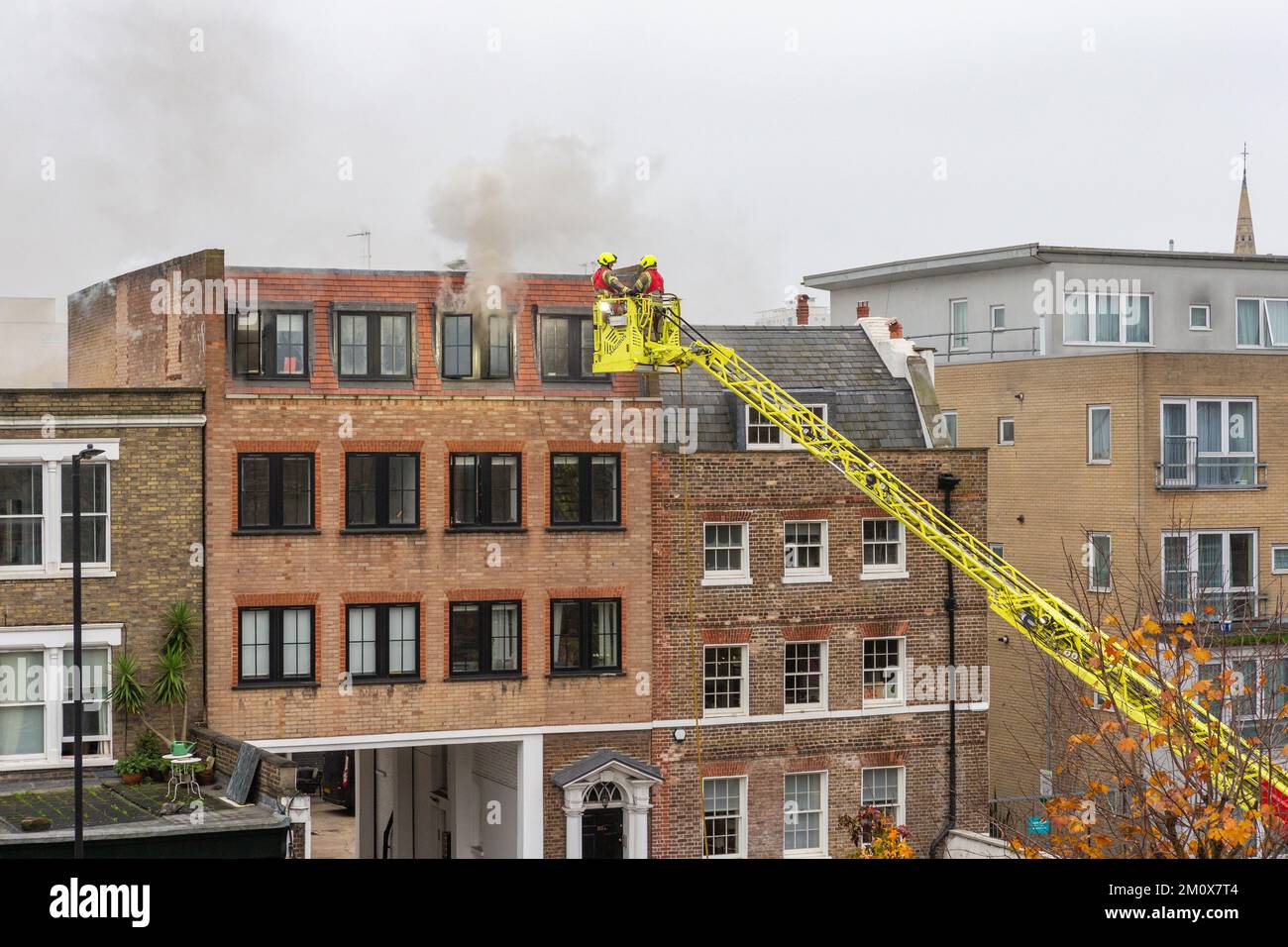 Fire Brigade attend to a fire in a residential building Stock Photo - Alamy