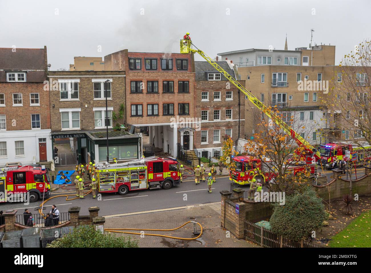 Fire Brigade attend to a fire in a residential building Stock Photo - Alamy