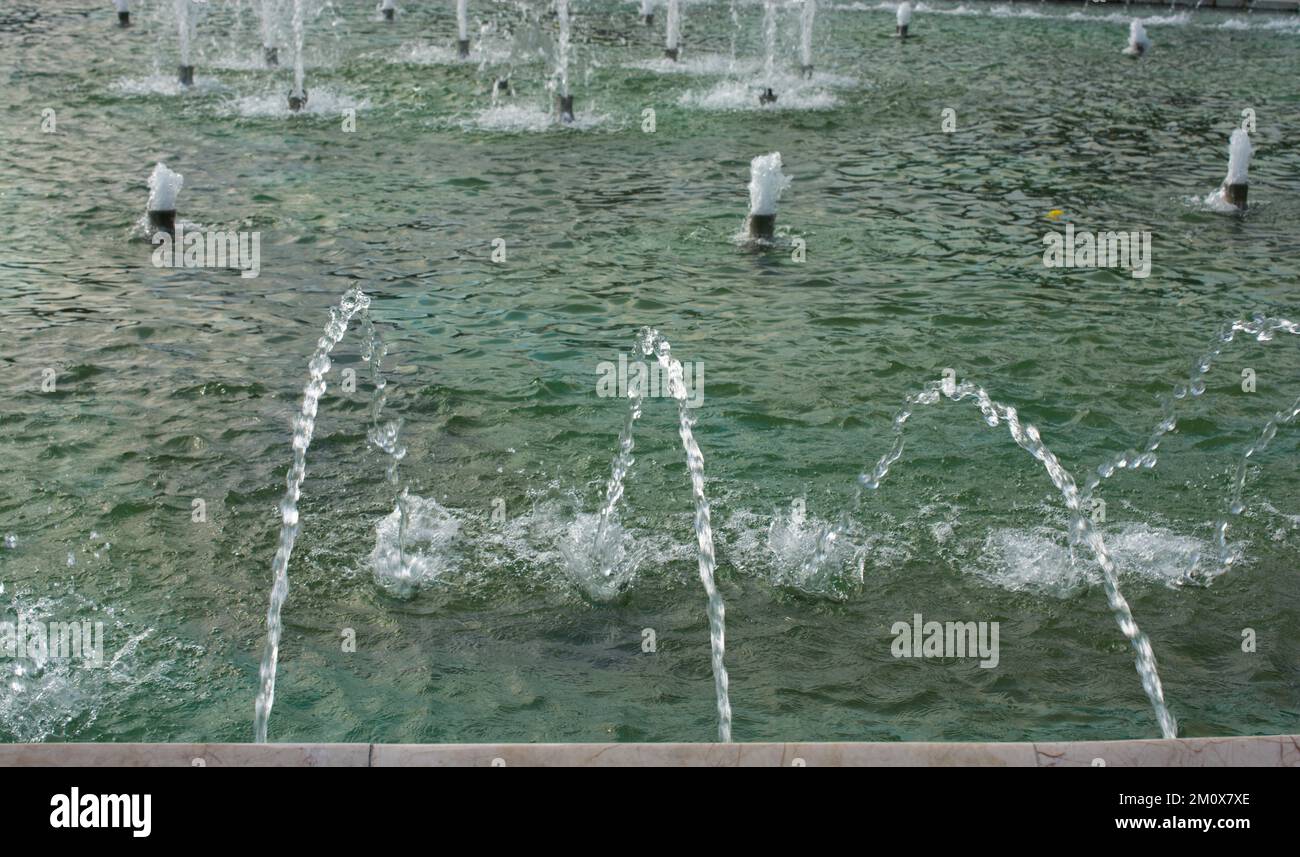 A water fountain sprinkling water in the view Stock Photo - Alamy