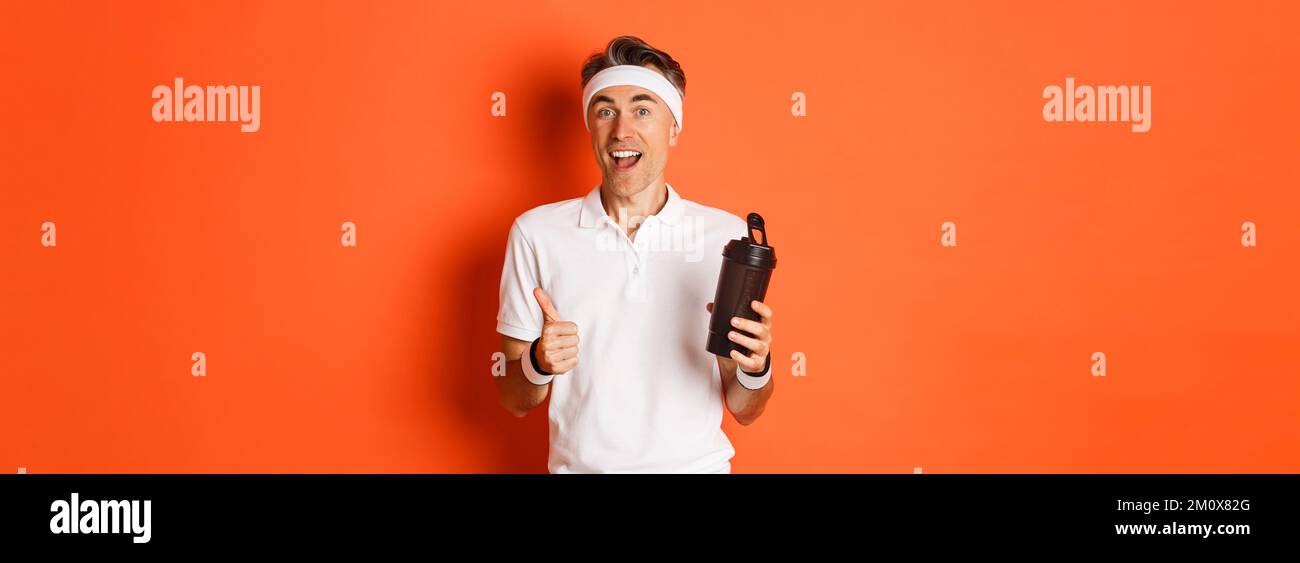 Portrait of healthy and active middle-aged fitness guy, wearing gym ...